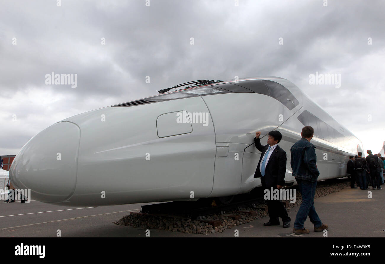 Visitors eye a Bombardier Zefiro highspeed train at InnoTrans trade ...