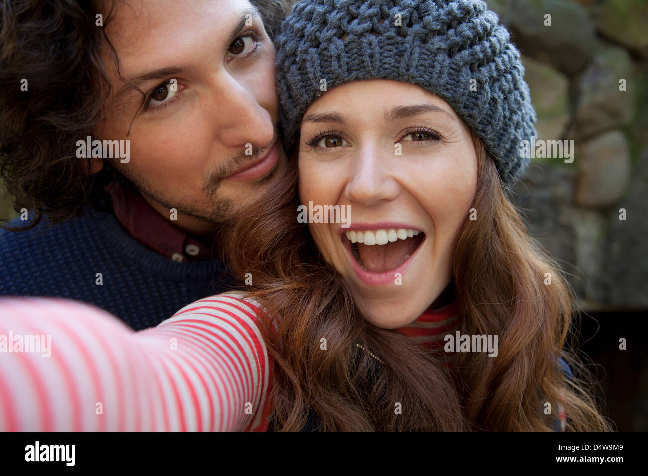 Couple taking picture together outdoors Stock Photo - Alamy