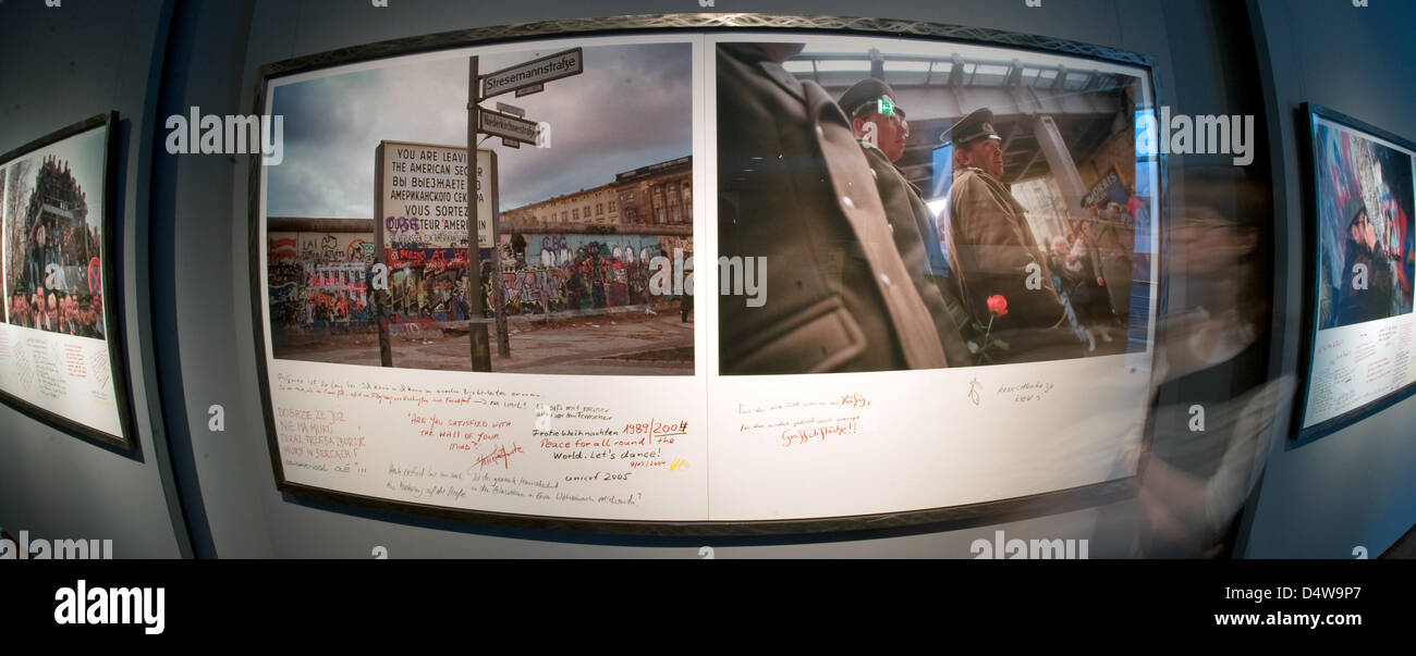 A woman eyes large photographies from the series 'The Fall' by Gilles ...
