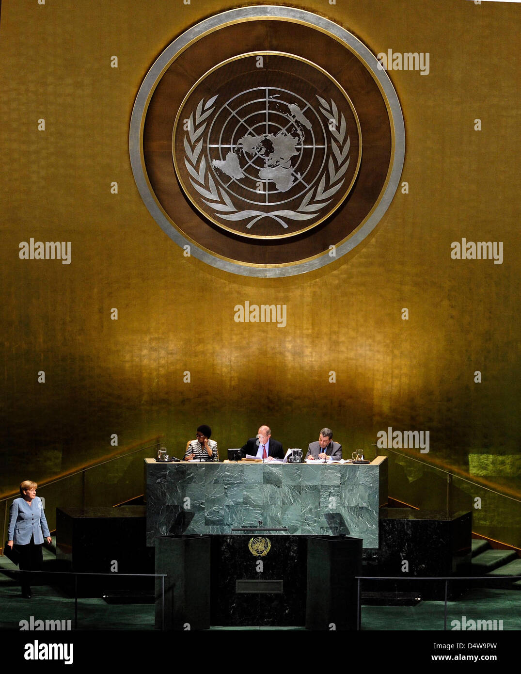 German Chancellor Angela Merkel delivers a speech to the 6th General ...