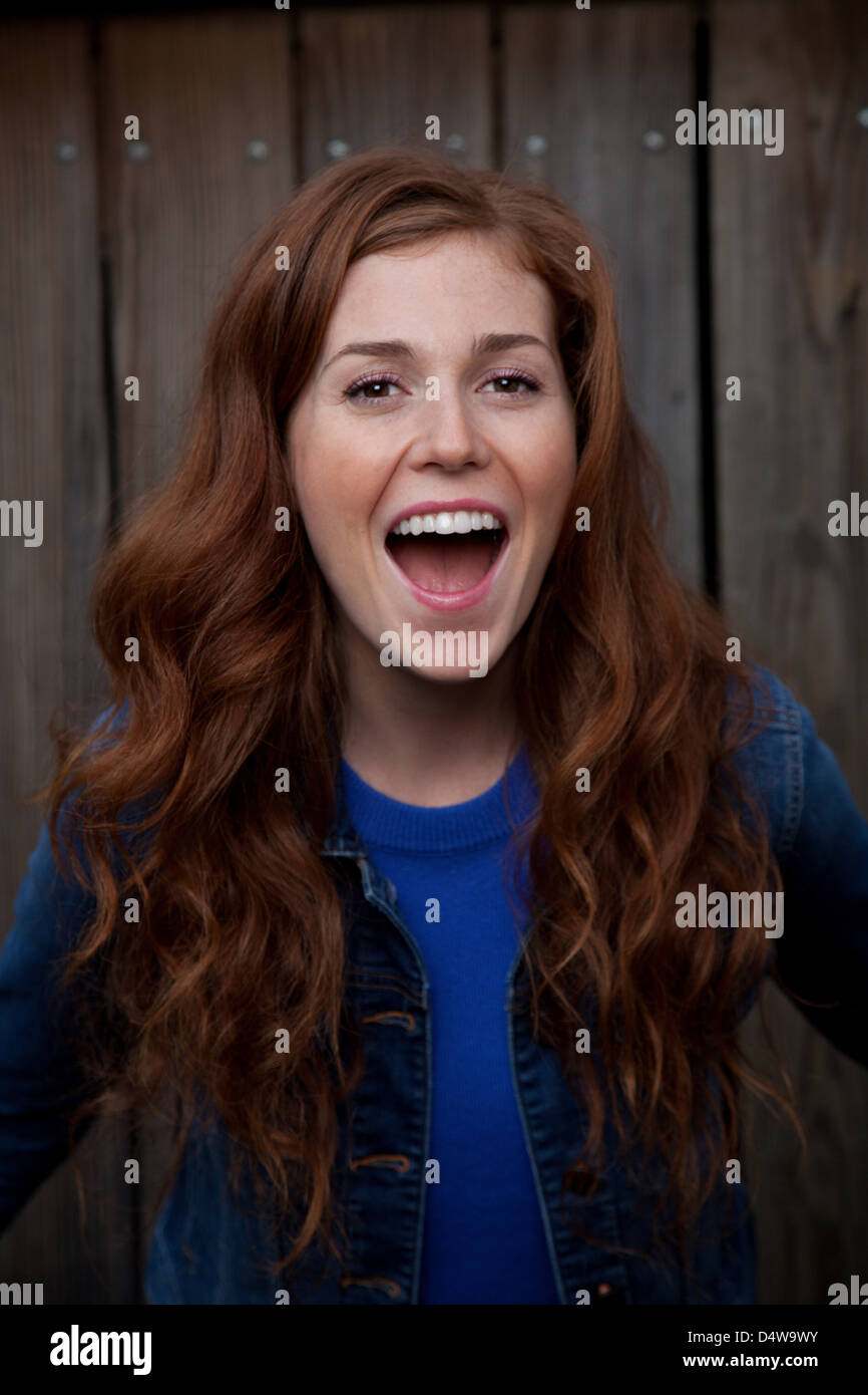 Woman laughing outdoors Stock Photo - Alamy