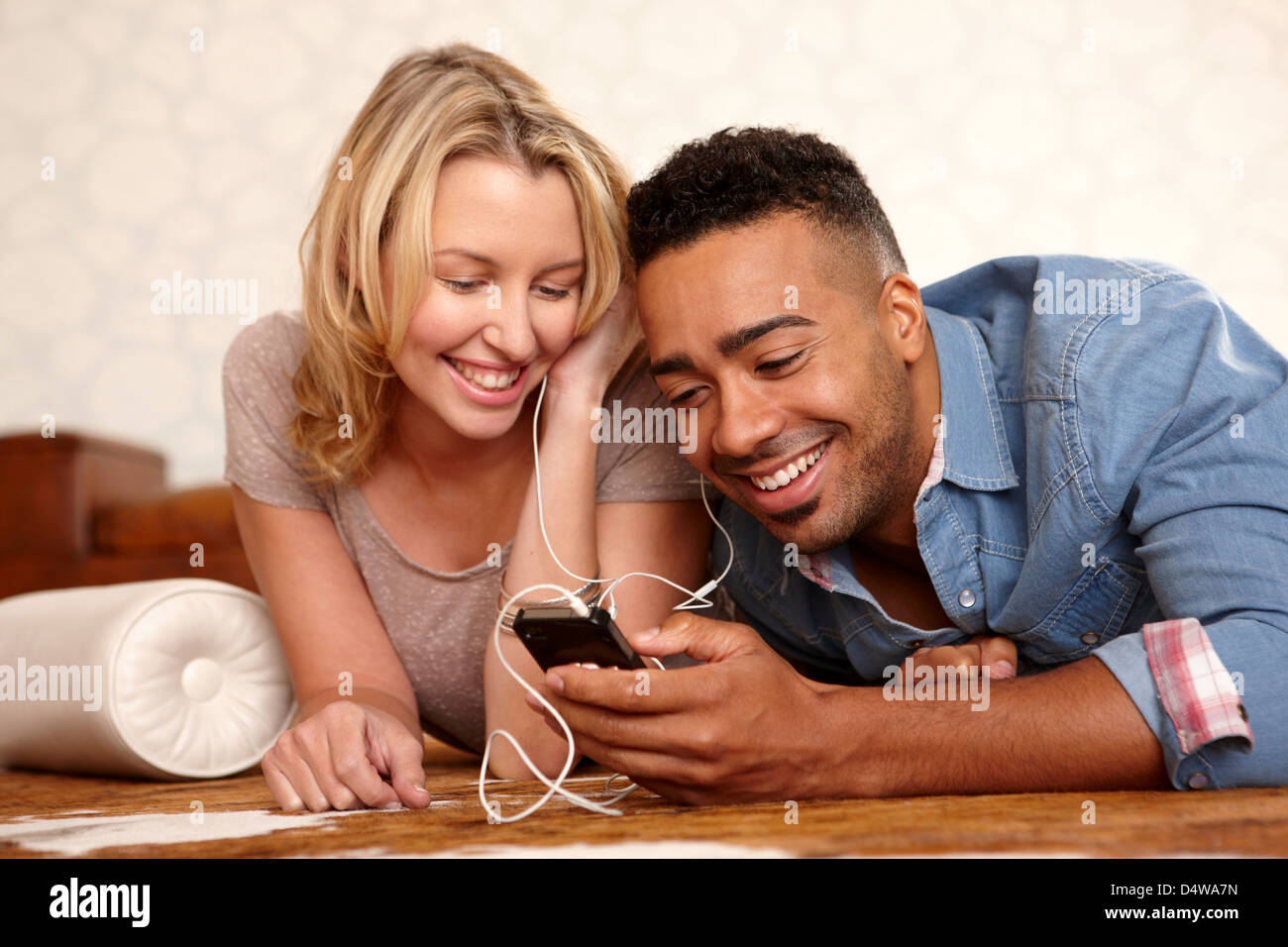 Couple sharing headphones hi-res stock photography and images - Alamy