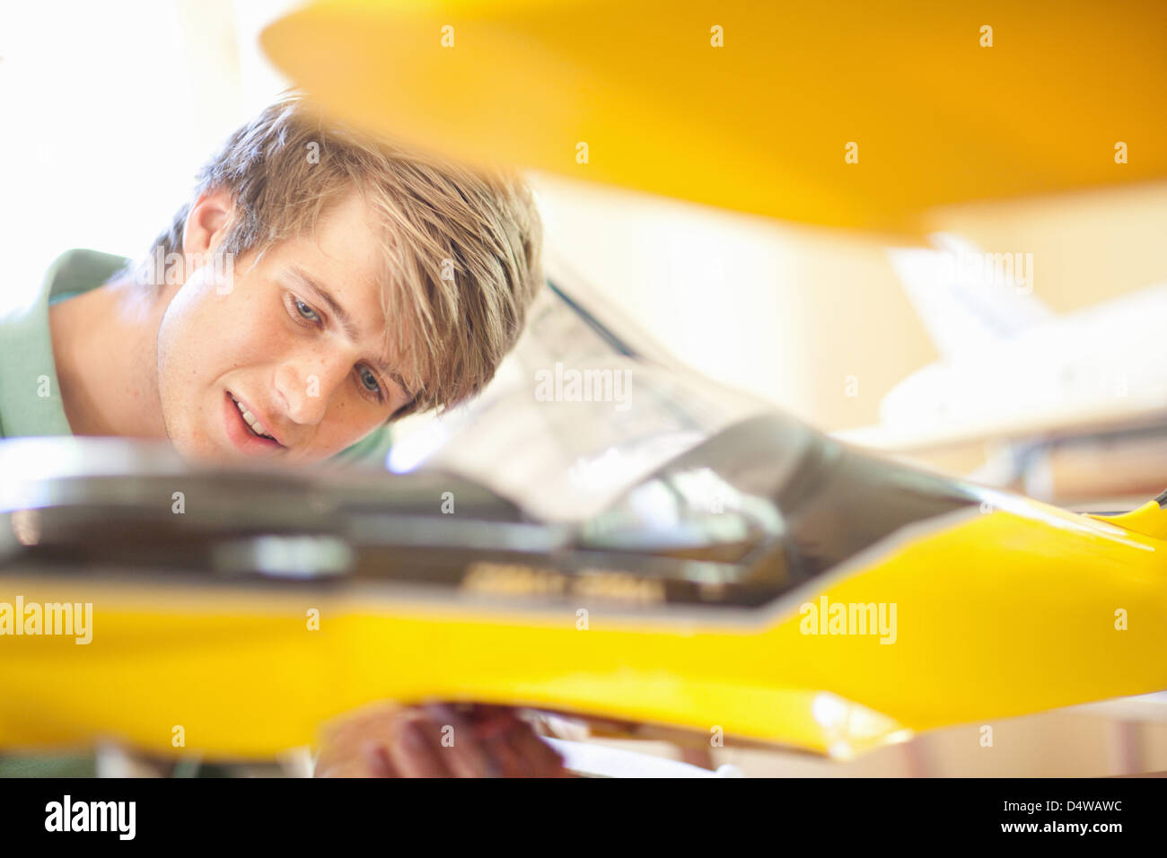 Man working on model airplane Stock Photo - Alamy