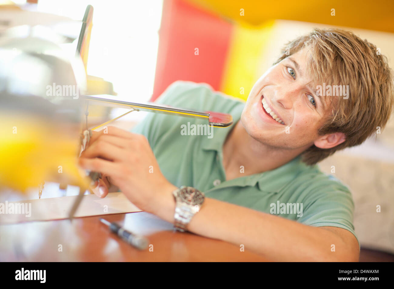 Man working on model airplane Stock Photo - Alamy