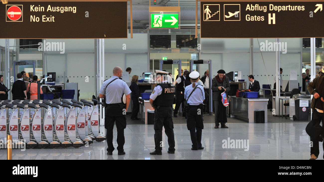 Police officers monitor the situation at the aiport on Munich, Germany ...