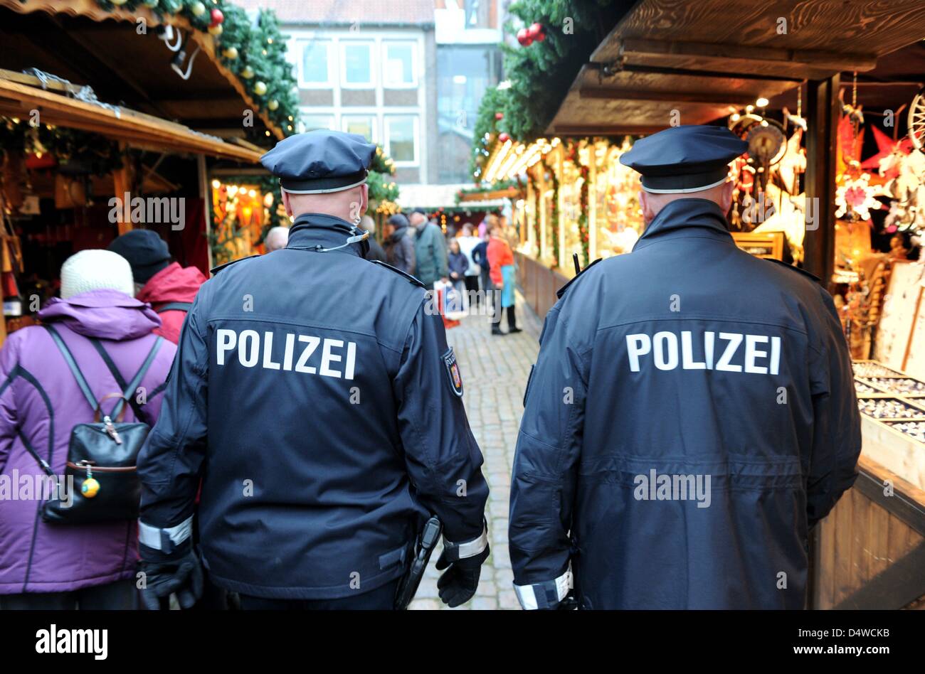 Police officers walk over the christmas market in Luebeck, Germany, 22 ...