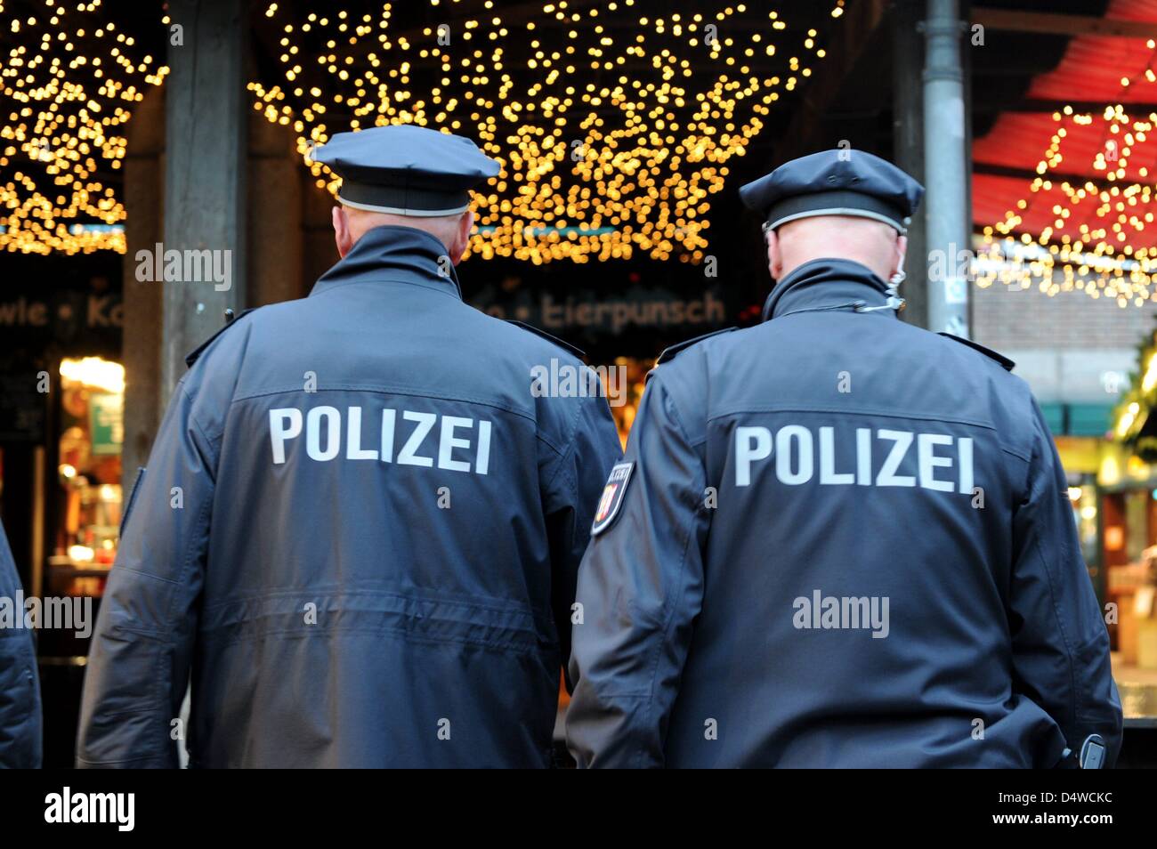Police officers walk over the christmas market in Luebeck, Germany, 22 ...