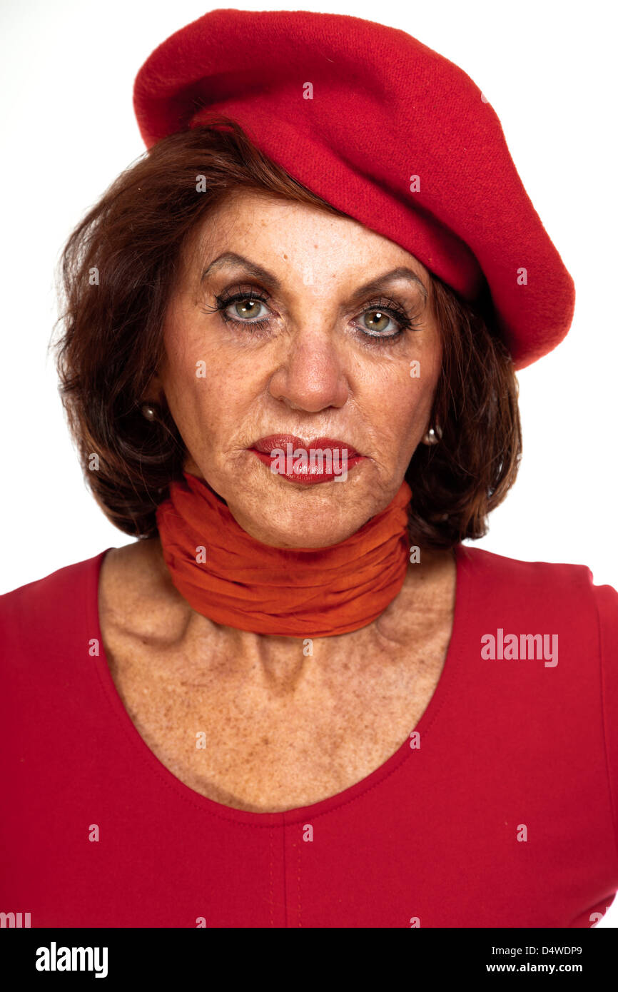 Fashionable senior woman. Wearing red hat. Isolated Stock Photo - Alamy