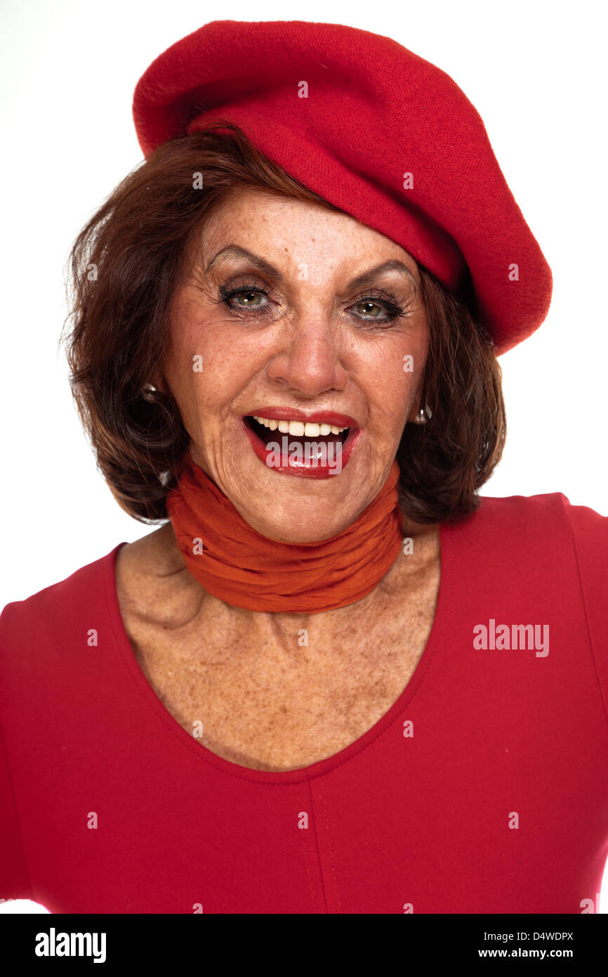 Fashionable senior woman. Wearing red hat. Isolated Stock Photo - Alamy