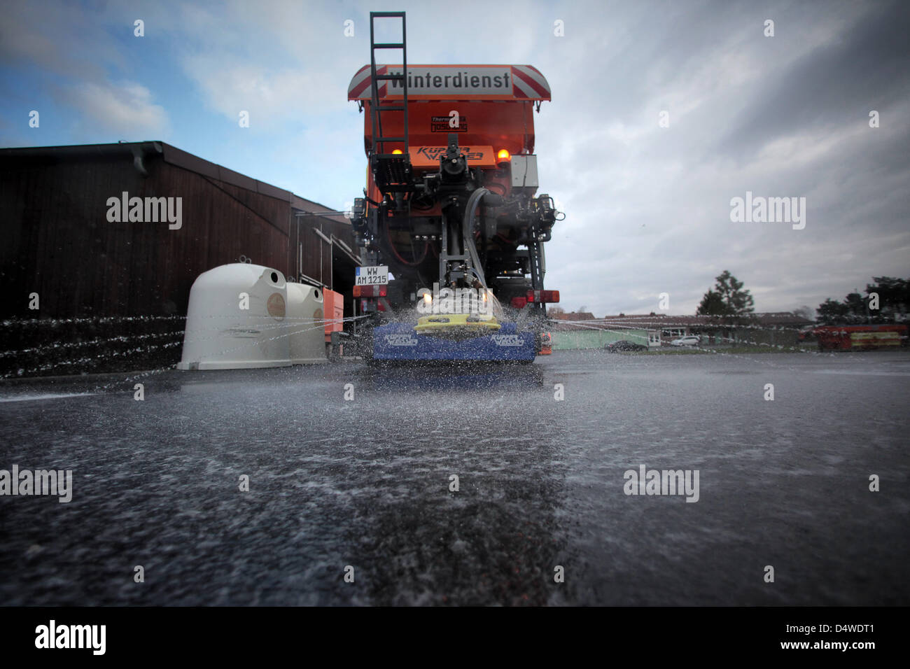 A new system of a gritter sprays special salt water onto the ground in ...