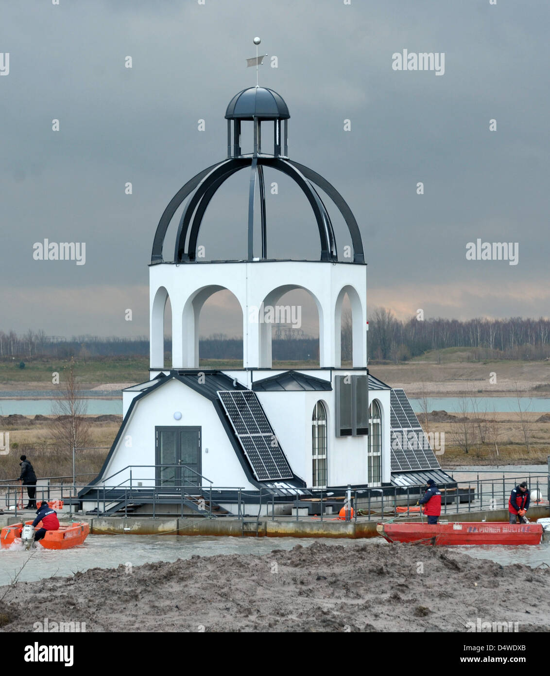 Two boats pull floating church 'Vineta' to its place on Stoermthaler ...