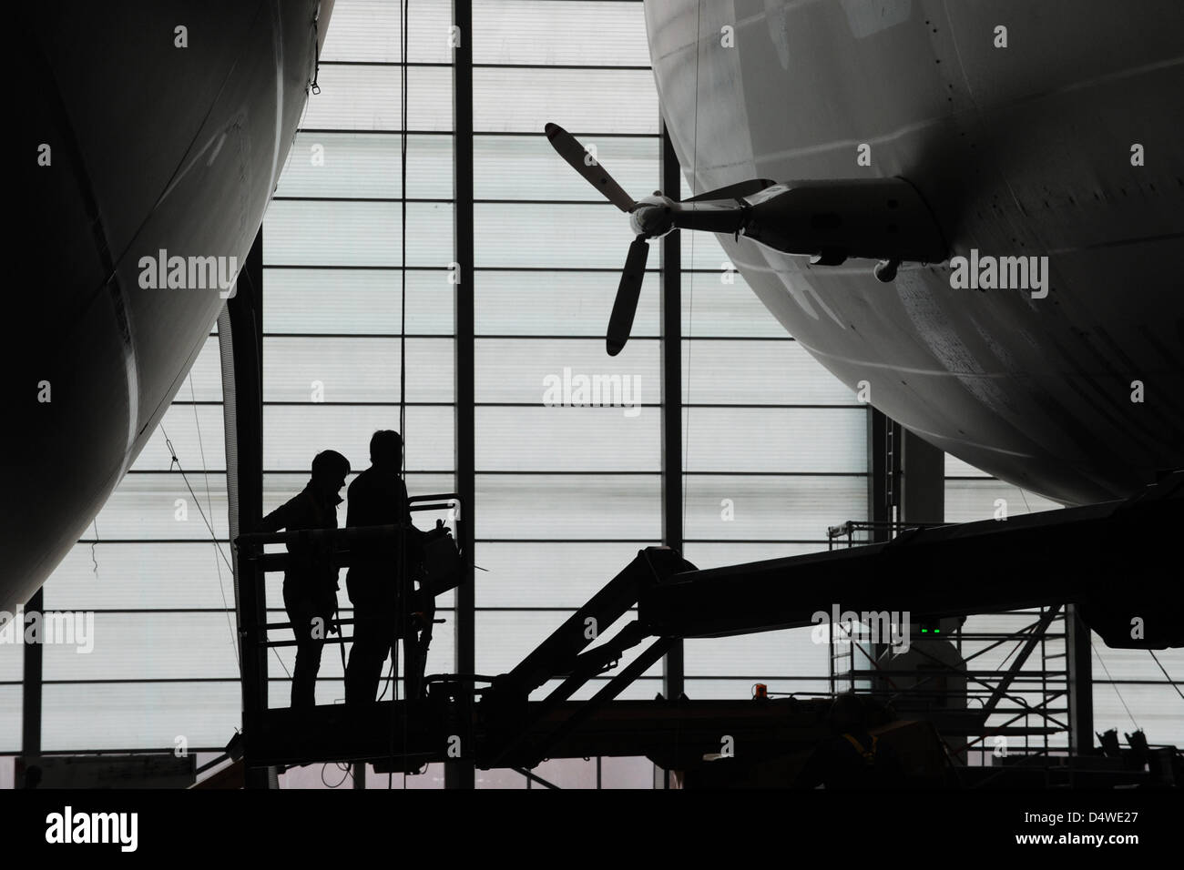 Two employees of the Zeppelin aircraft works drive along the mantle of ...
