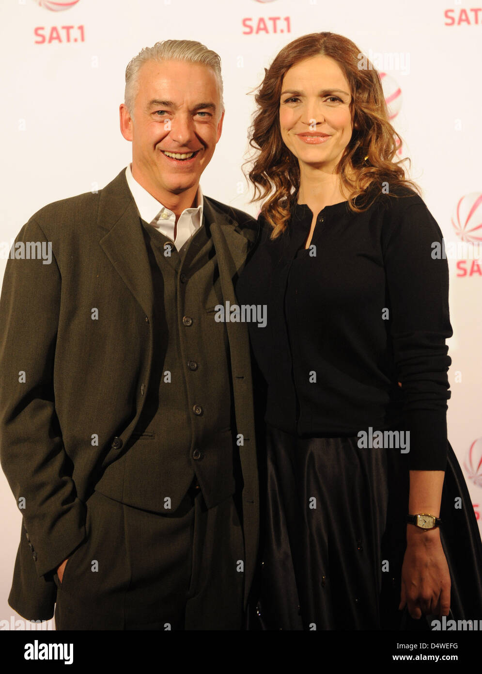 German actors Christoph M. Ohrt (L) and Rebecca Immanuel (R) smile as ...
