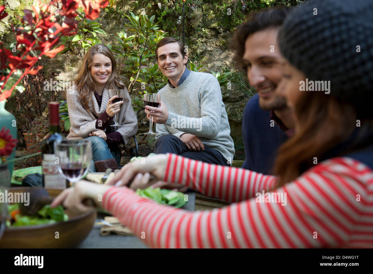 Friends eating together outdoors Stock Photo - Alamy