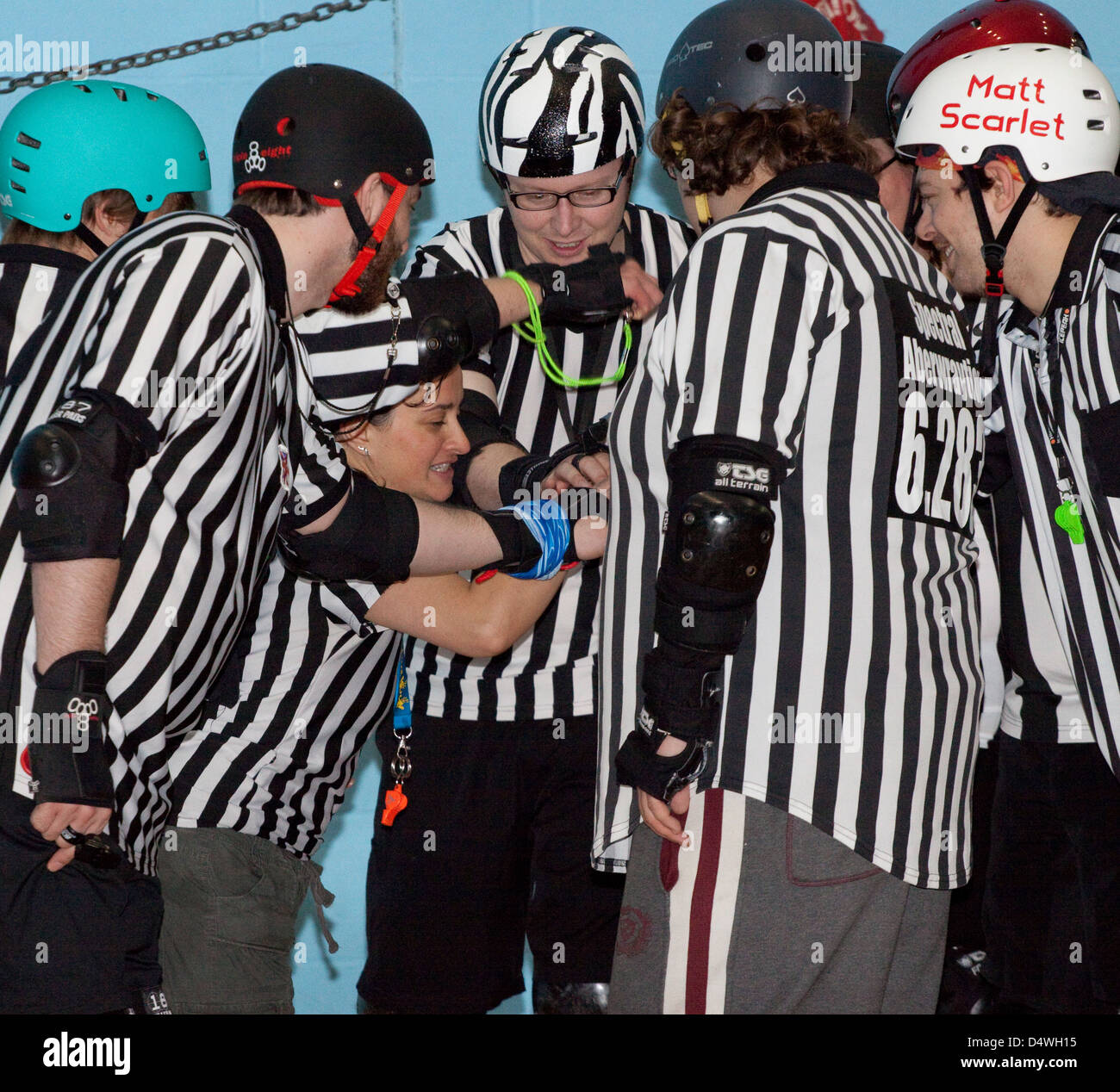 A group of mainly male roller derby referees building some team spirit ...