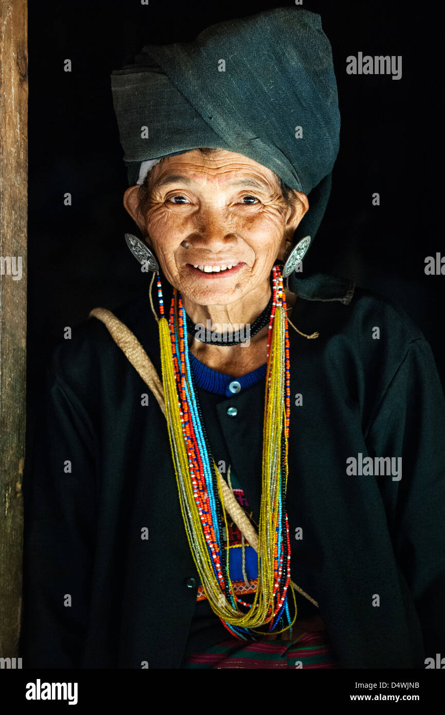 A woman from Akha tribal village wearing traditional clothes and ...