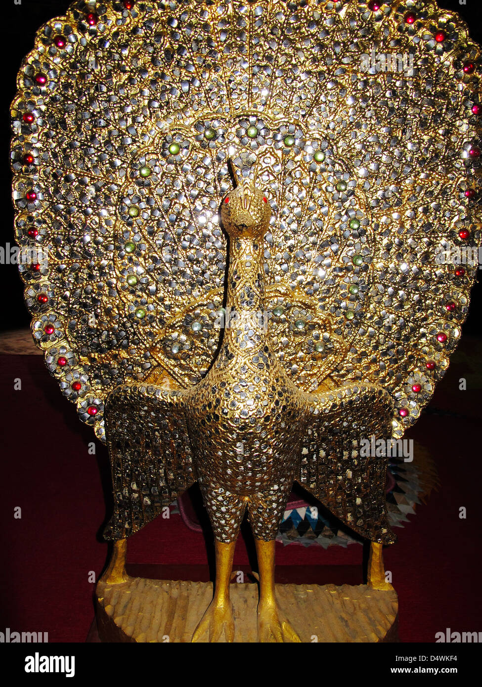 A peacock figurine covered in precious stones, Wat Inn monastery ...