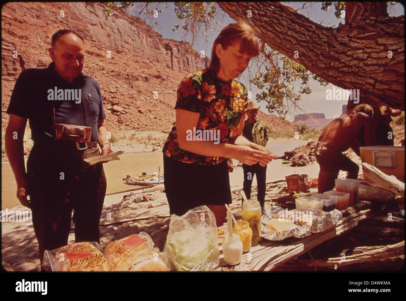 A photograph from May 1972 showing a group of people taking a lunch ...
