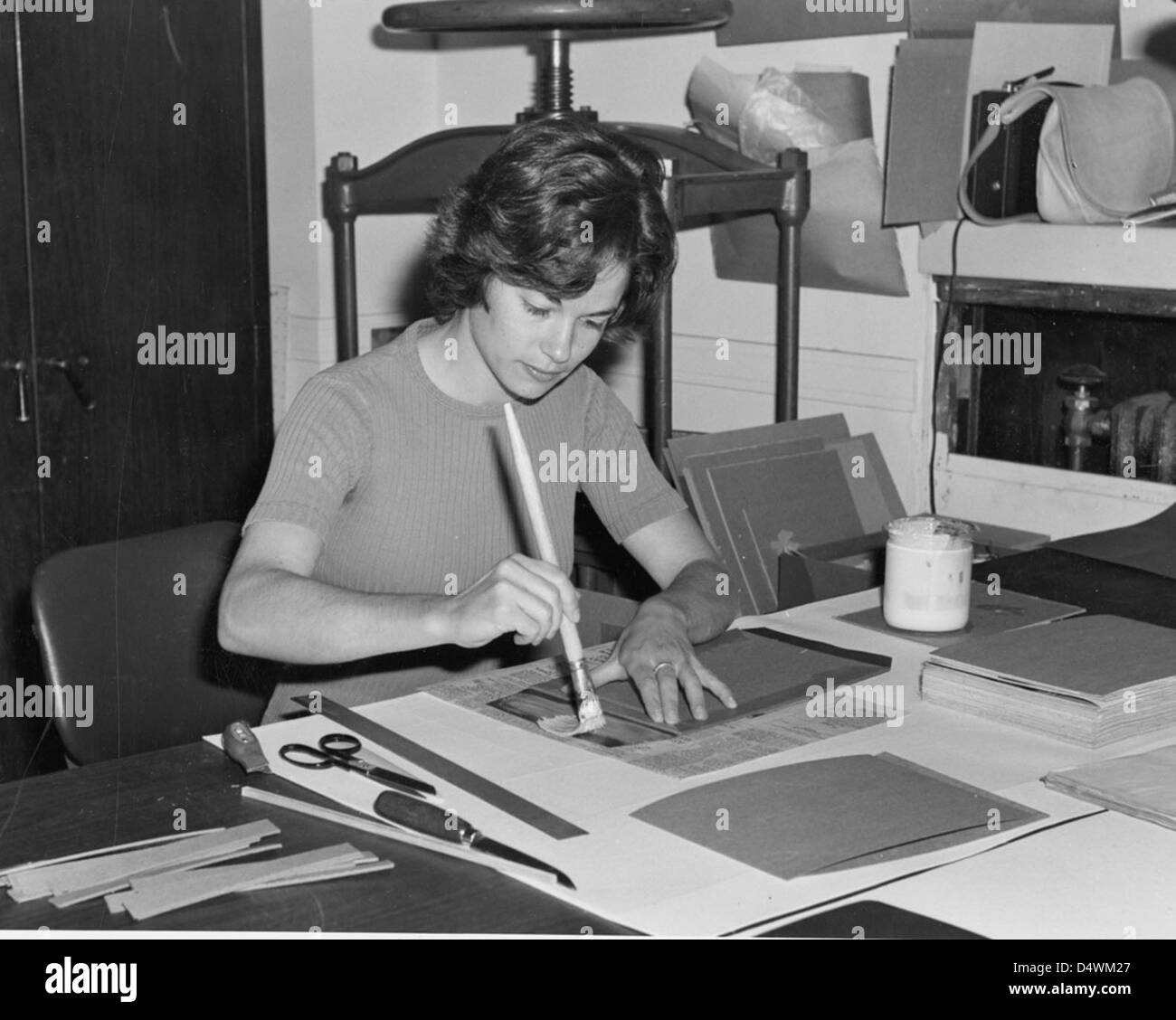 Sharon Conway is photographed performing bookbinding in document ...