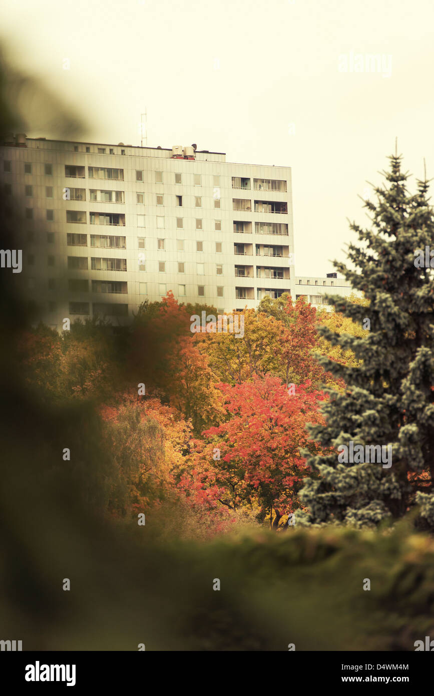Apartment building and autumn forest Stock Photo - Alamy