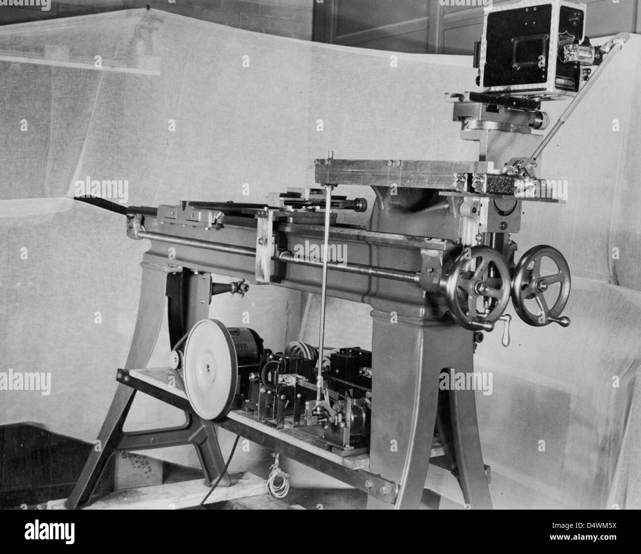 A photograph taken in 1940 of an optical printer, a key device in the ...