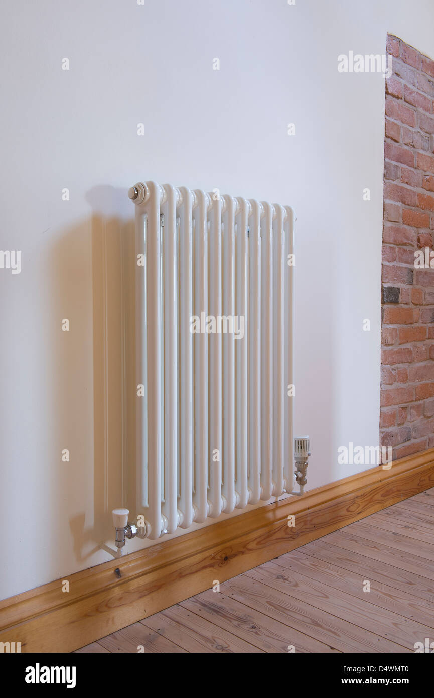 Wall mounted radiator in a newly converted barn in rural England Stock ...