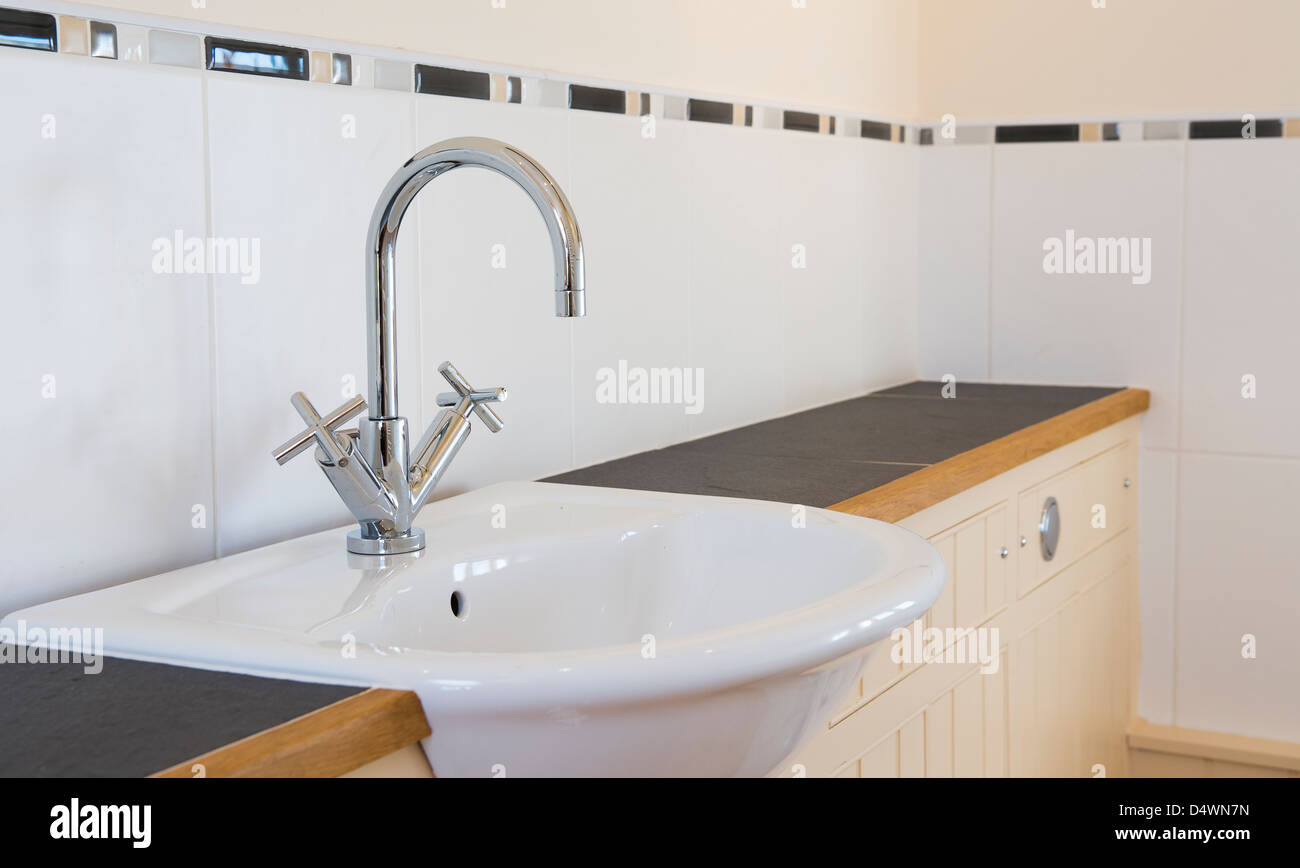 Close up of a sink and tiling in a newly decorated bathroom Stock Photo ...