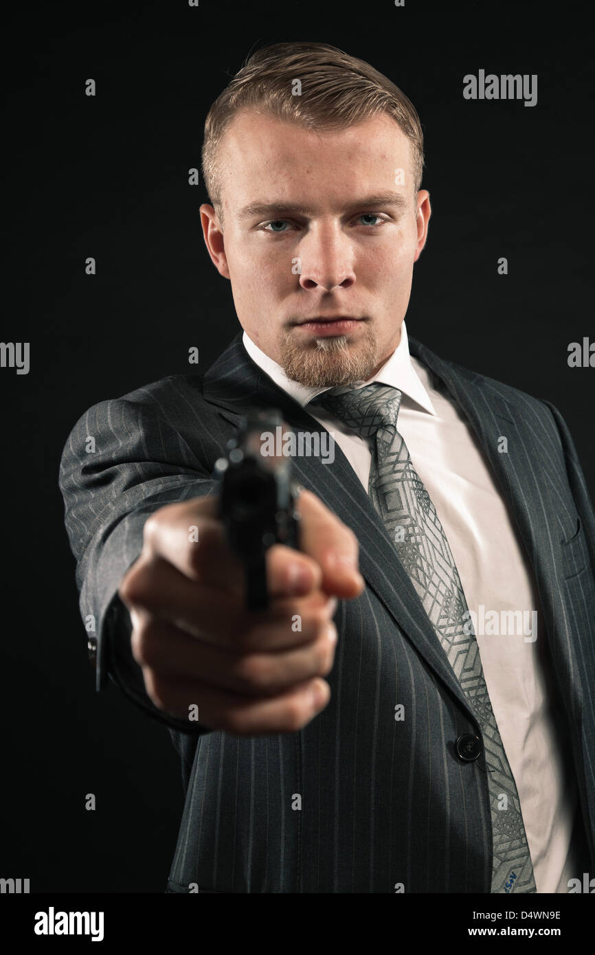 Man in business suit gun hi-res stock photography and images - Alamy