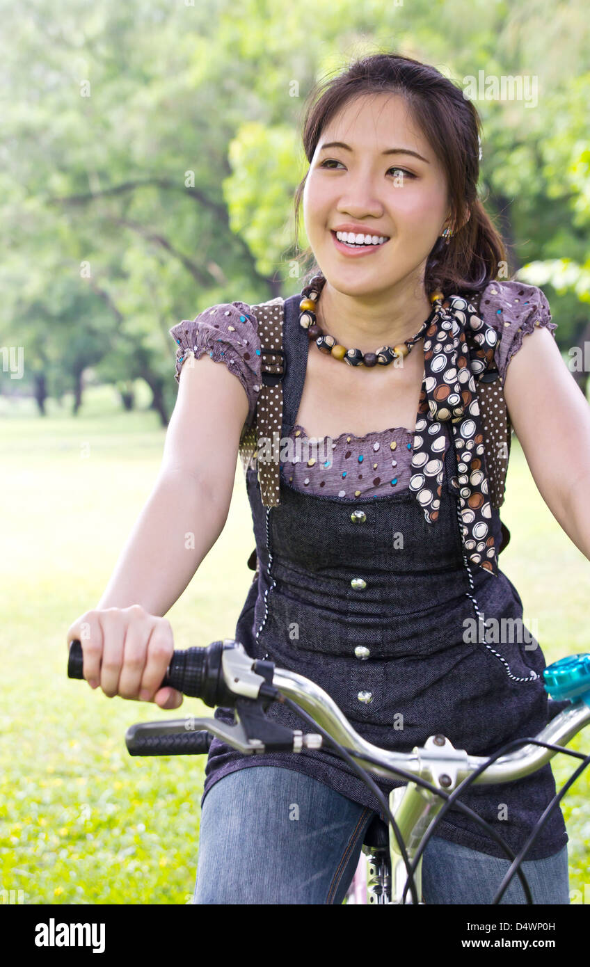 Beautiful girl riding bicycle hi-res stock photography and images - Alamy