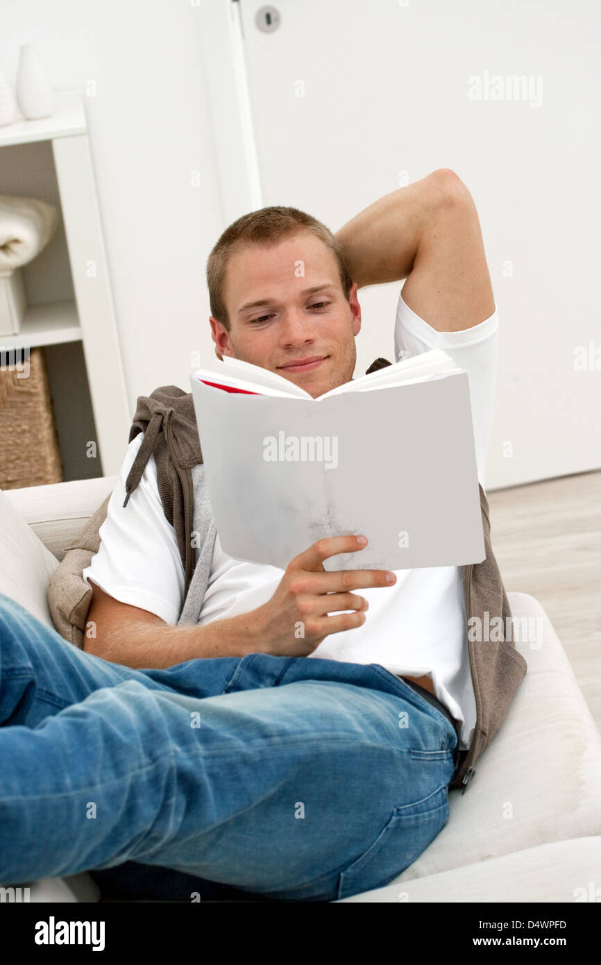 Book reading male adult relaxing hi-res stock photography and images ...