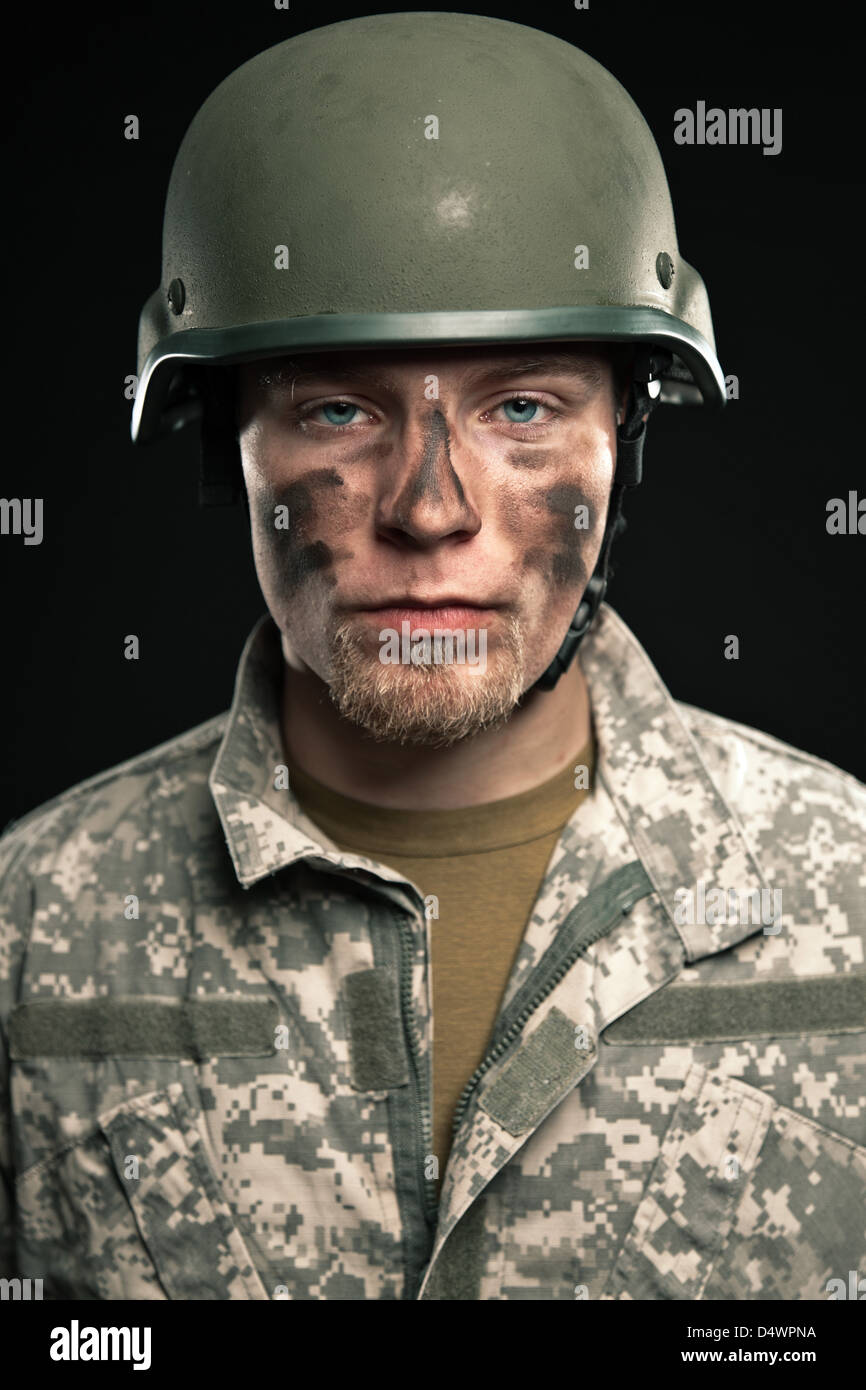 Military young man wearing helmet. Studio portrait Stock Photo - Alamy