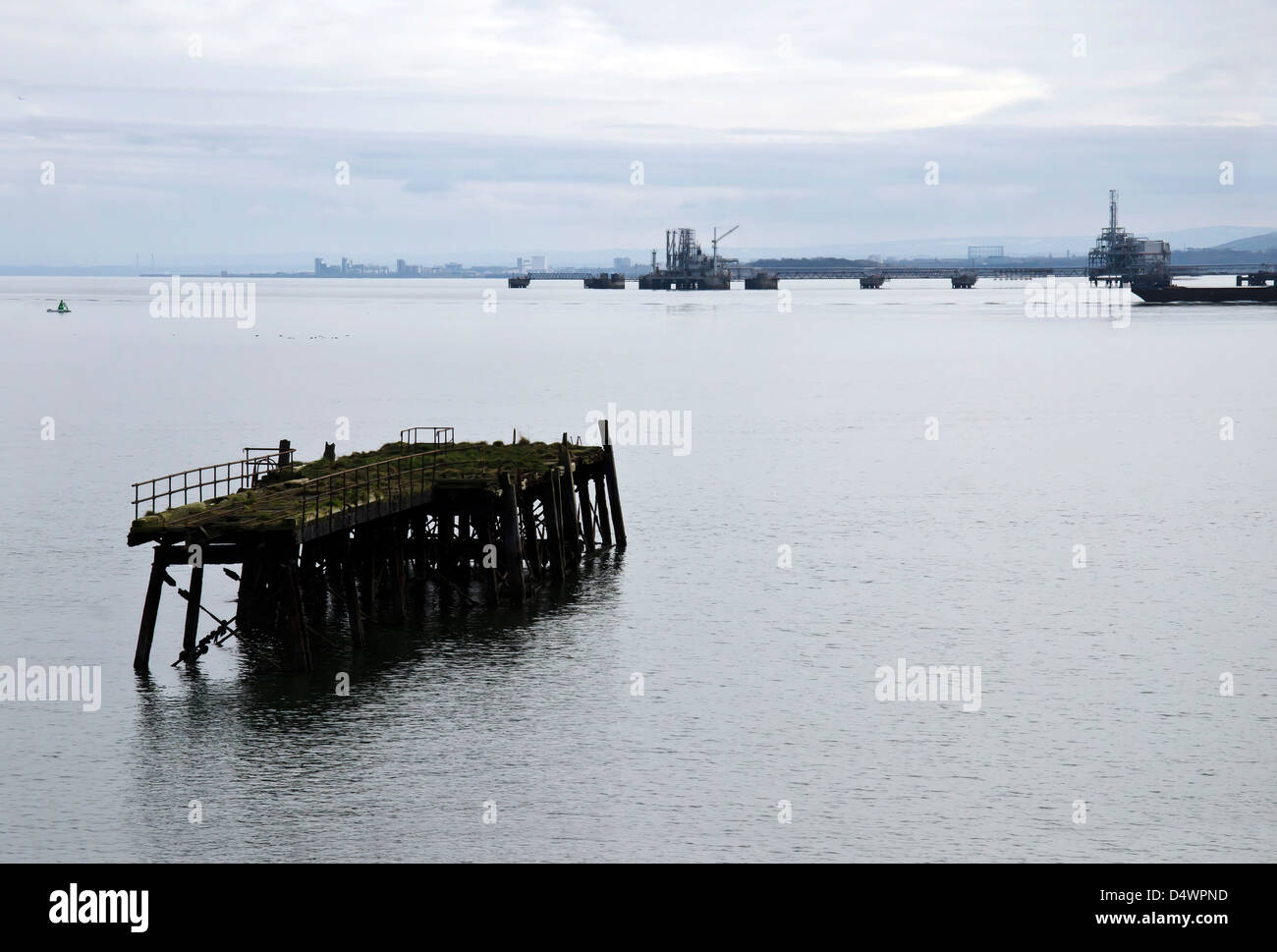 Old disused pier near Burntisland in Fife, Scotland. Ferries used to ...