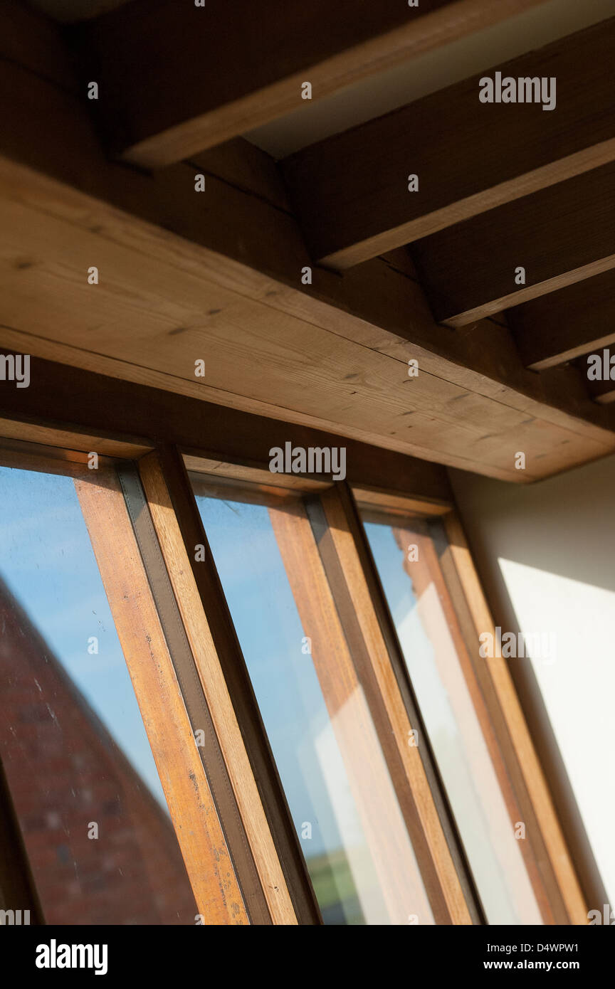 Double glazed window and oak beams in a newly converted barn in rural ...