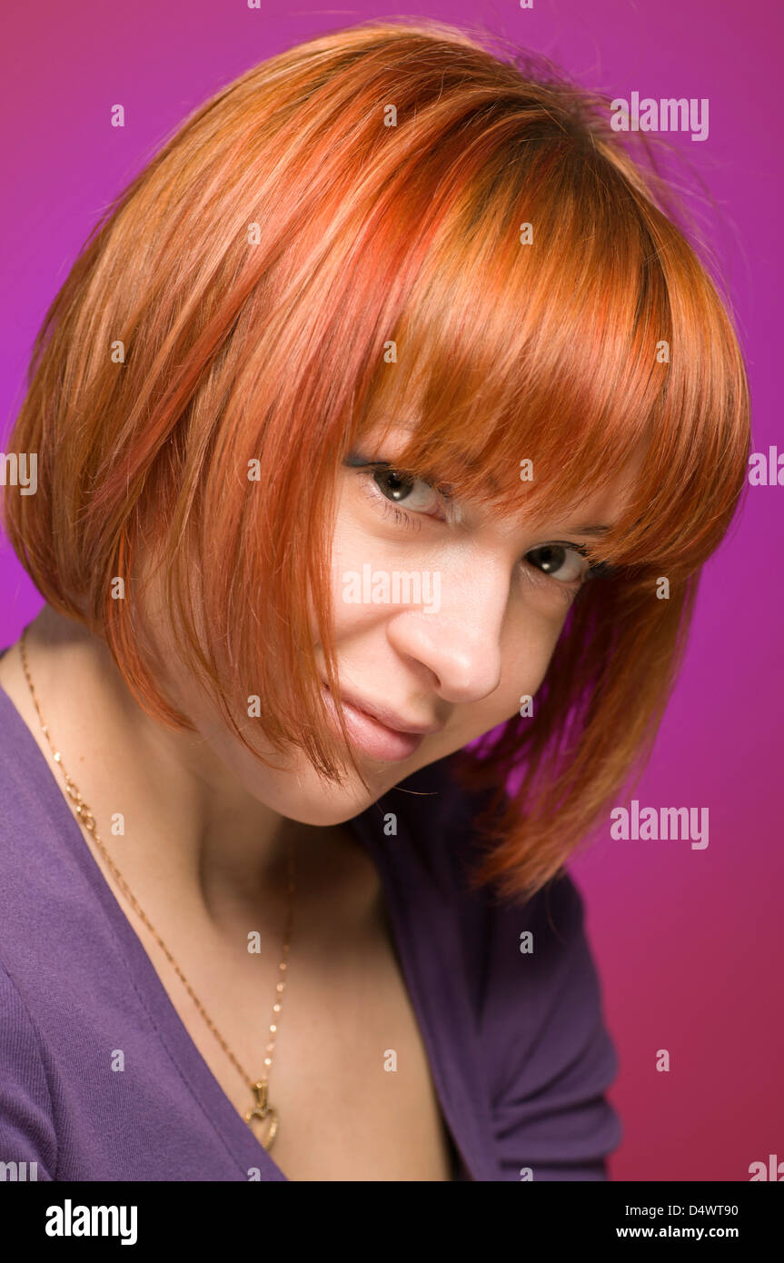 Portrait of beautiful red woman posing at the studio Stock Photo - Alamy