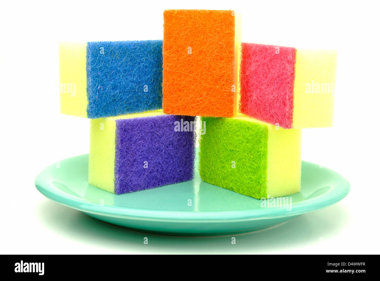 five colorful scrub sponges on a plate Stock Photo - Alamy