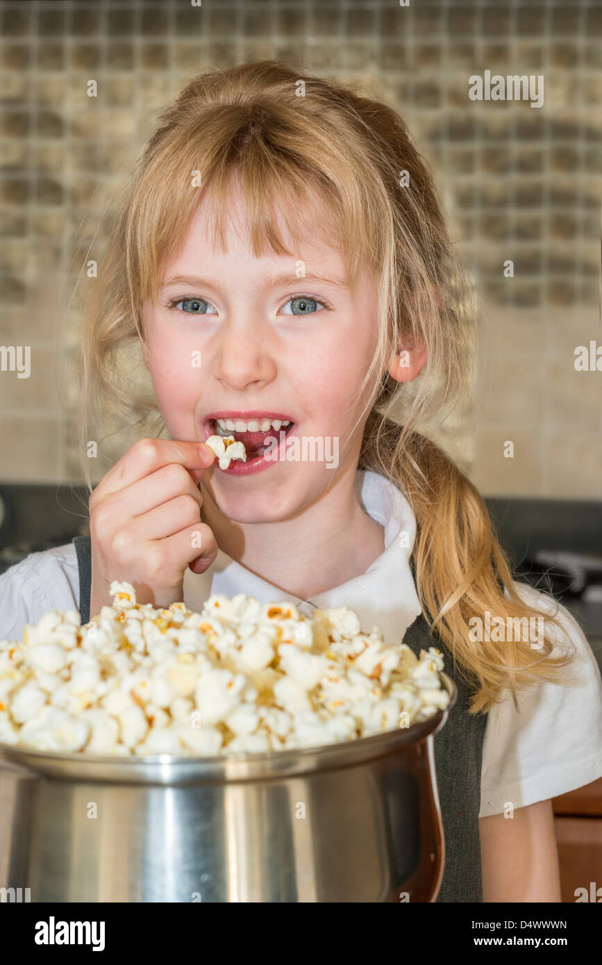 girl eating popcorn Stock Photo - Alamy