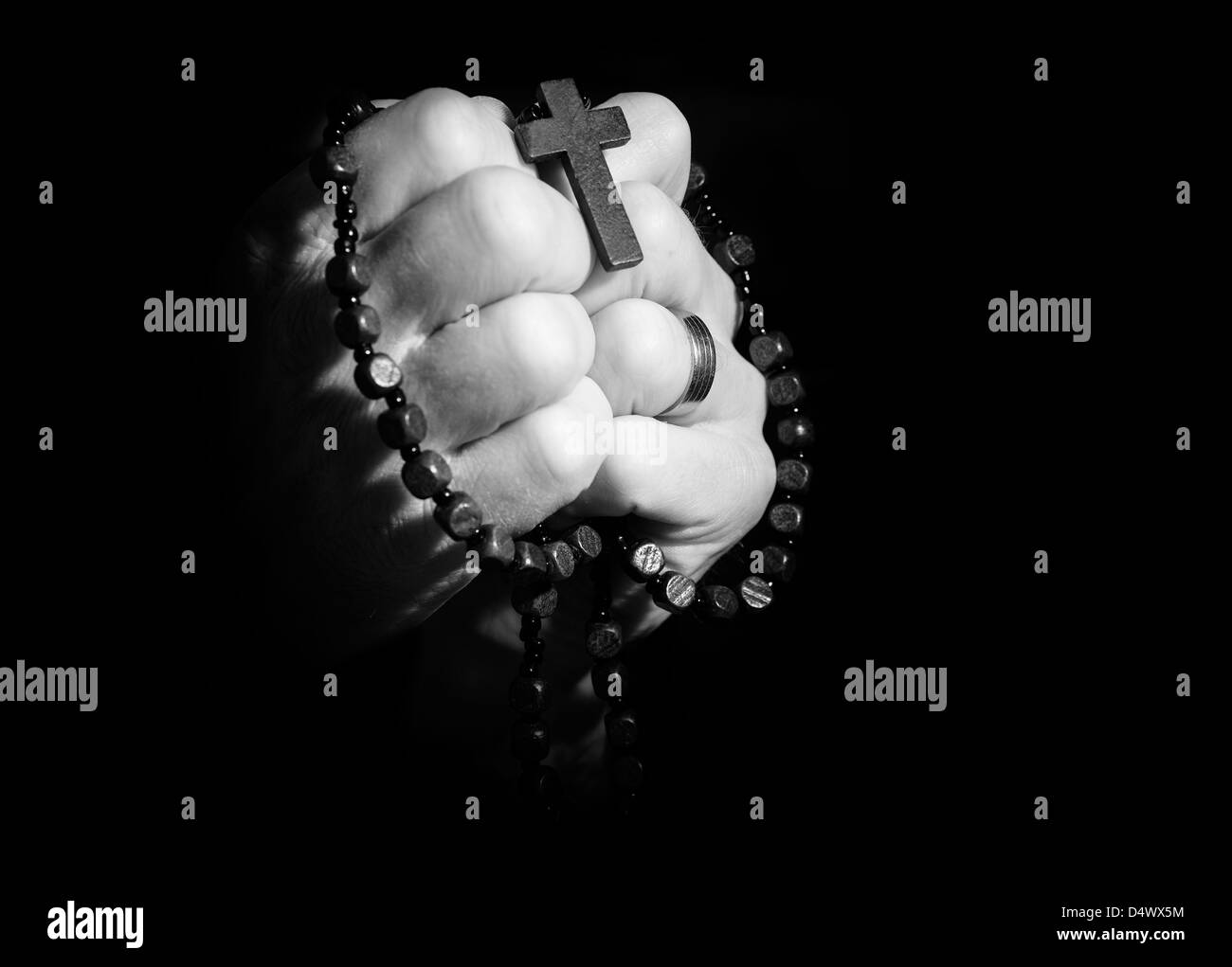 Hands with rosary beads Black and White Stock Photos & Images - Alamy