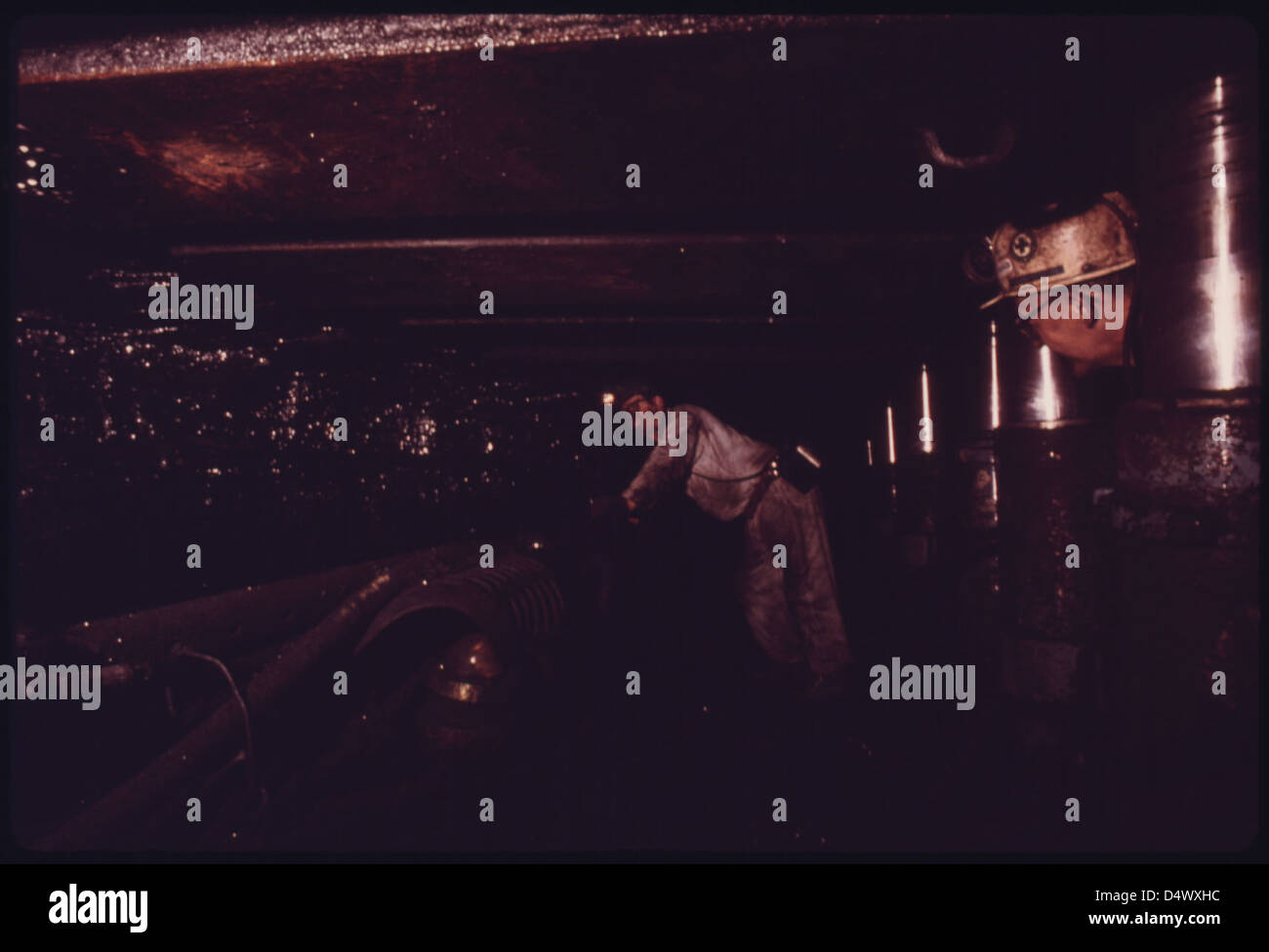 A section of a long wall mine, showing ceiling supports and mining ...