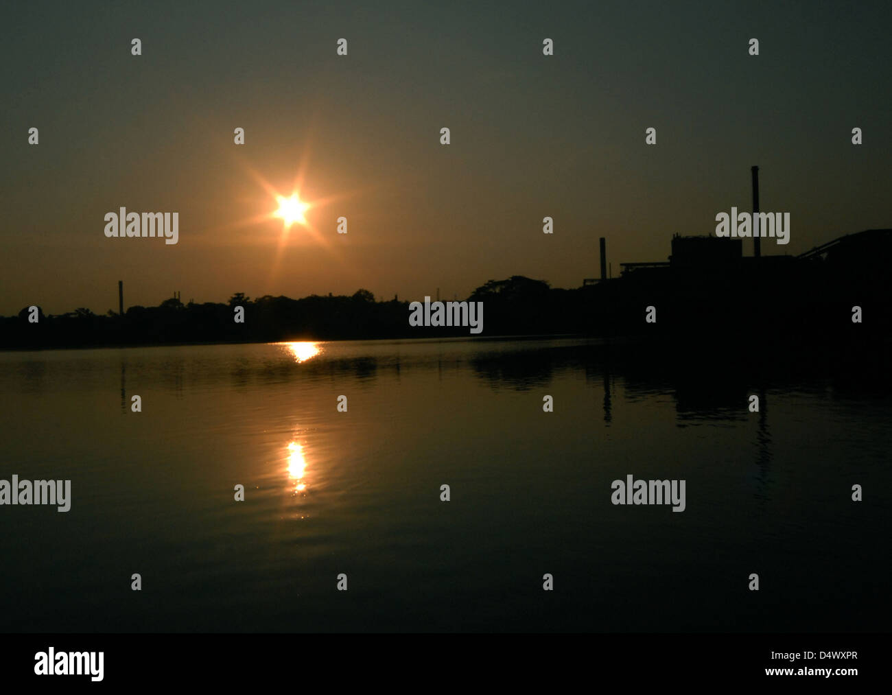 sun set on a river Stock Photo - Alamy