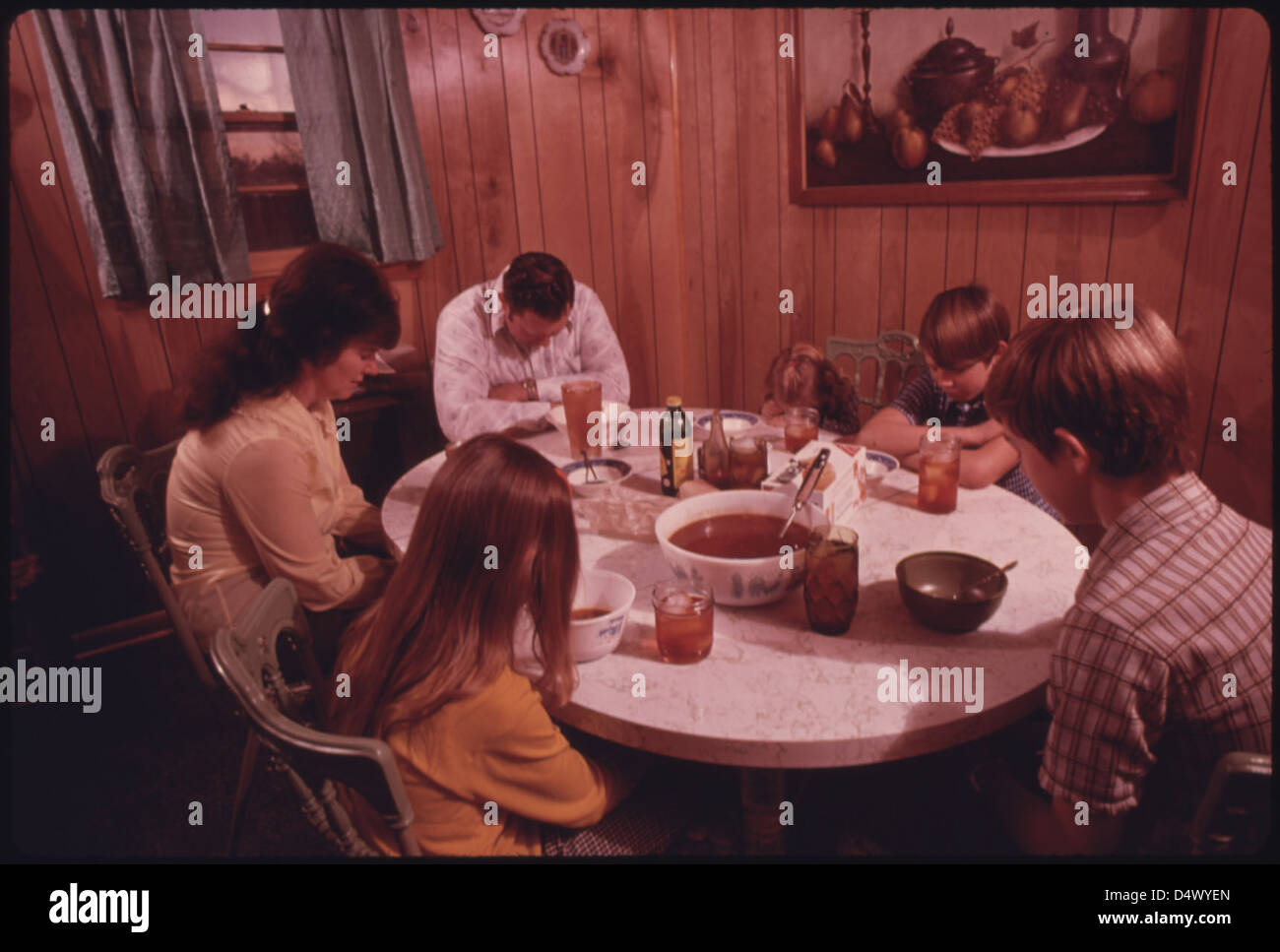 This 1974 photograph captures the Wayne Gipson family saying a prayer ...