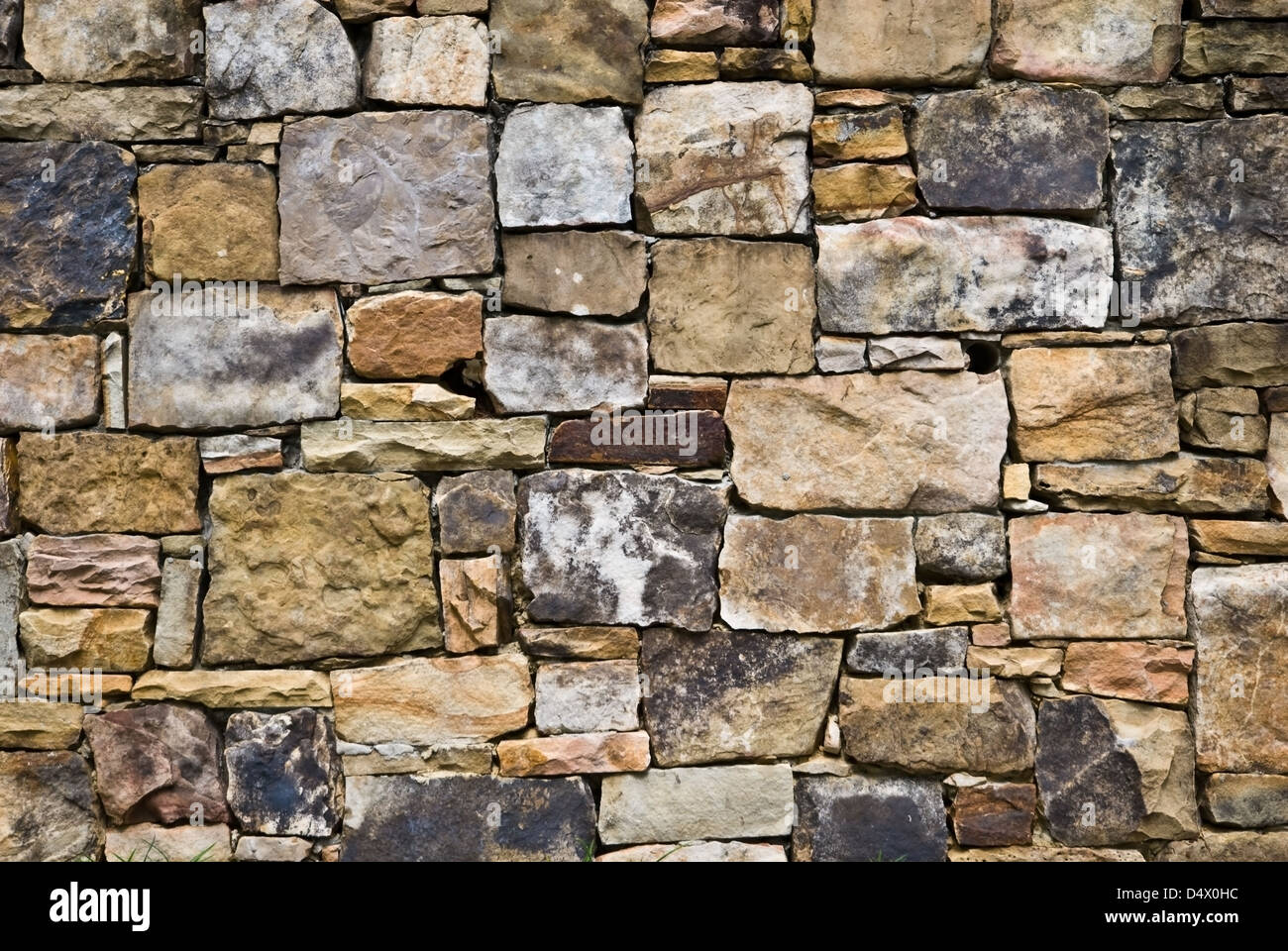 A beautifully designed natural rock wall. Many colors and sizes mixed ...