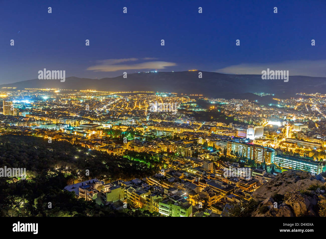 Athens skyline aerial view in the afternoon with the lights over blue ...