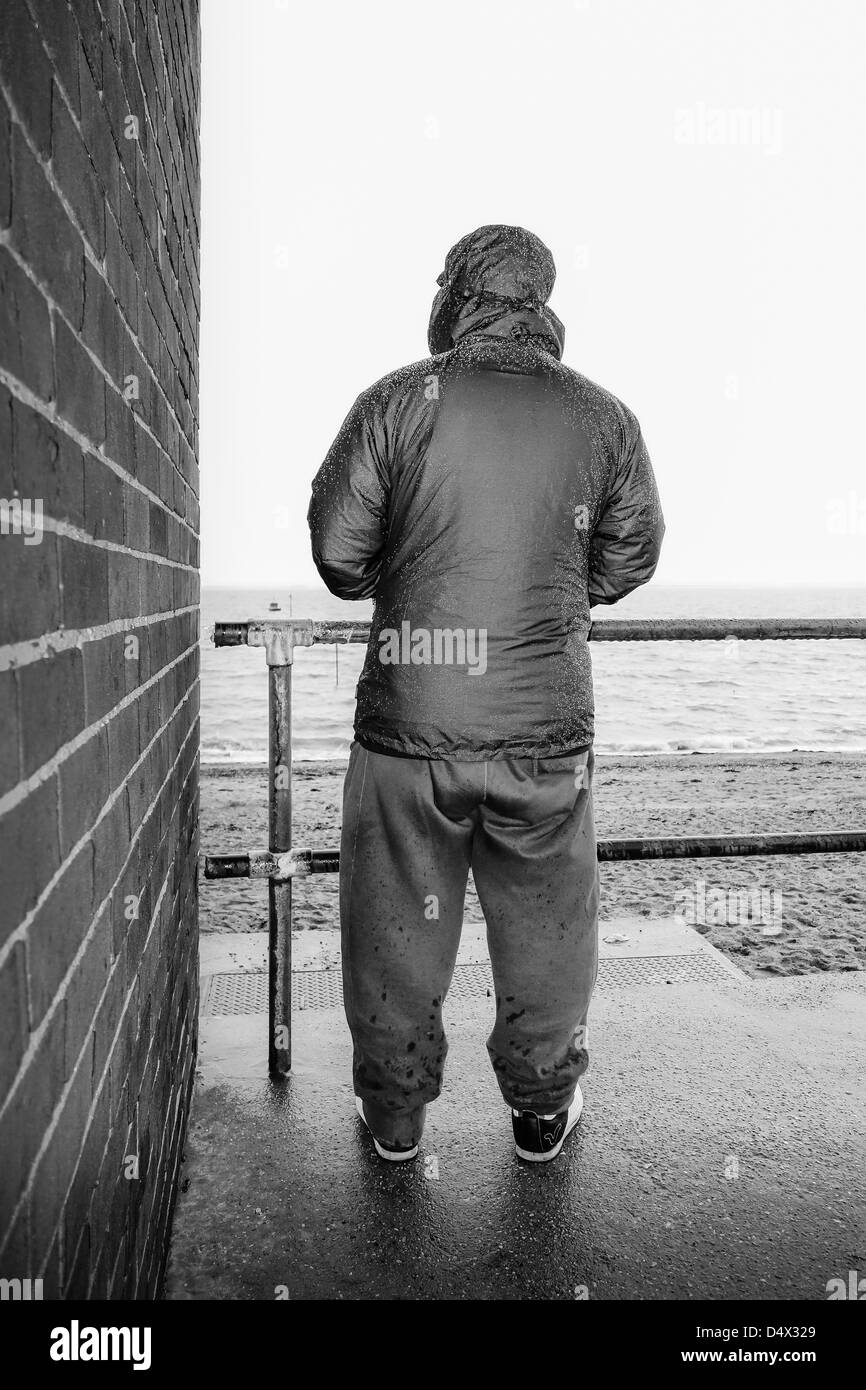Staring out to sea Stock Photo - Alamy