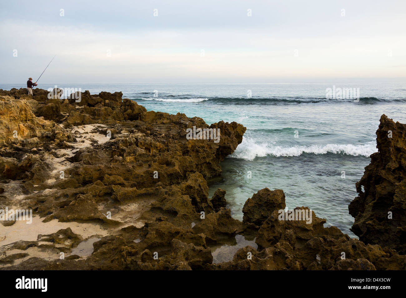 Fishing off the rocks Stock Photo - Alamy