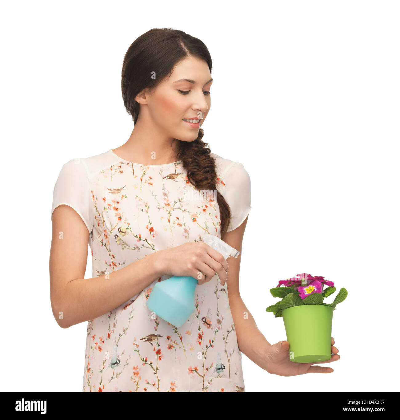 woman holding pot with flower and spray bottle Stock Photo - Alamy