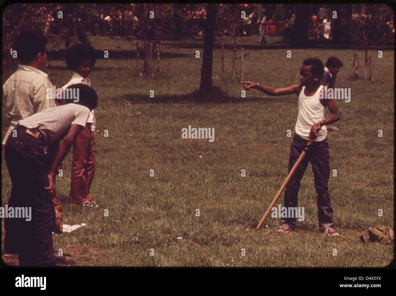 Children playing stickball in Battery Park, New York City, in May 1973 ...