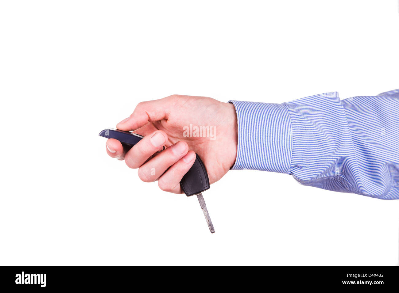 Male hand holding a car key isolated on white background. New car ...