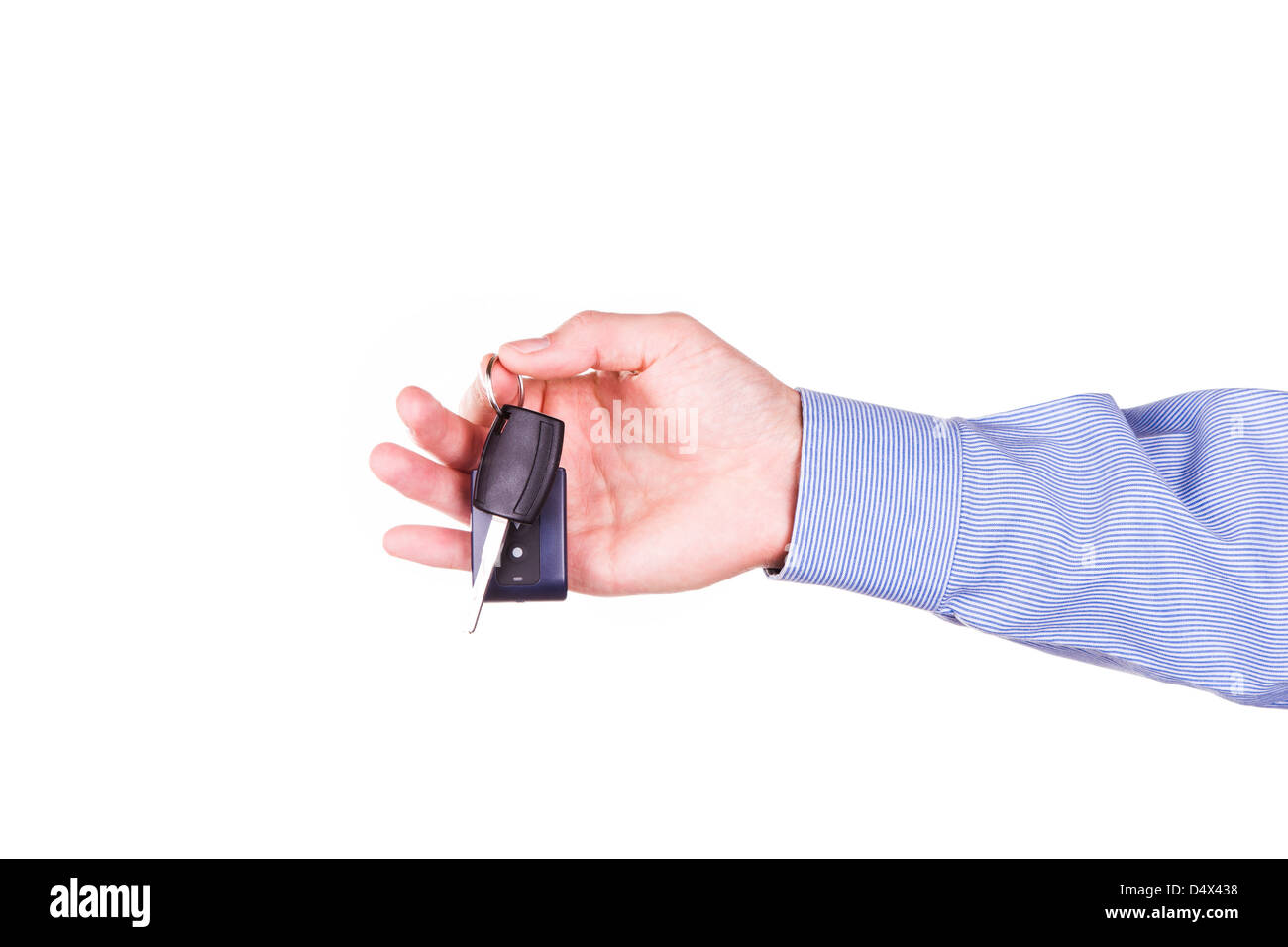 Male hand holding a car key isolated on white background. New car ...