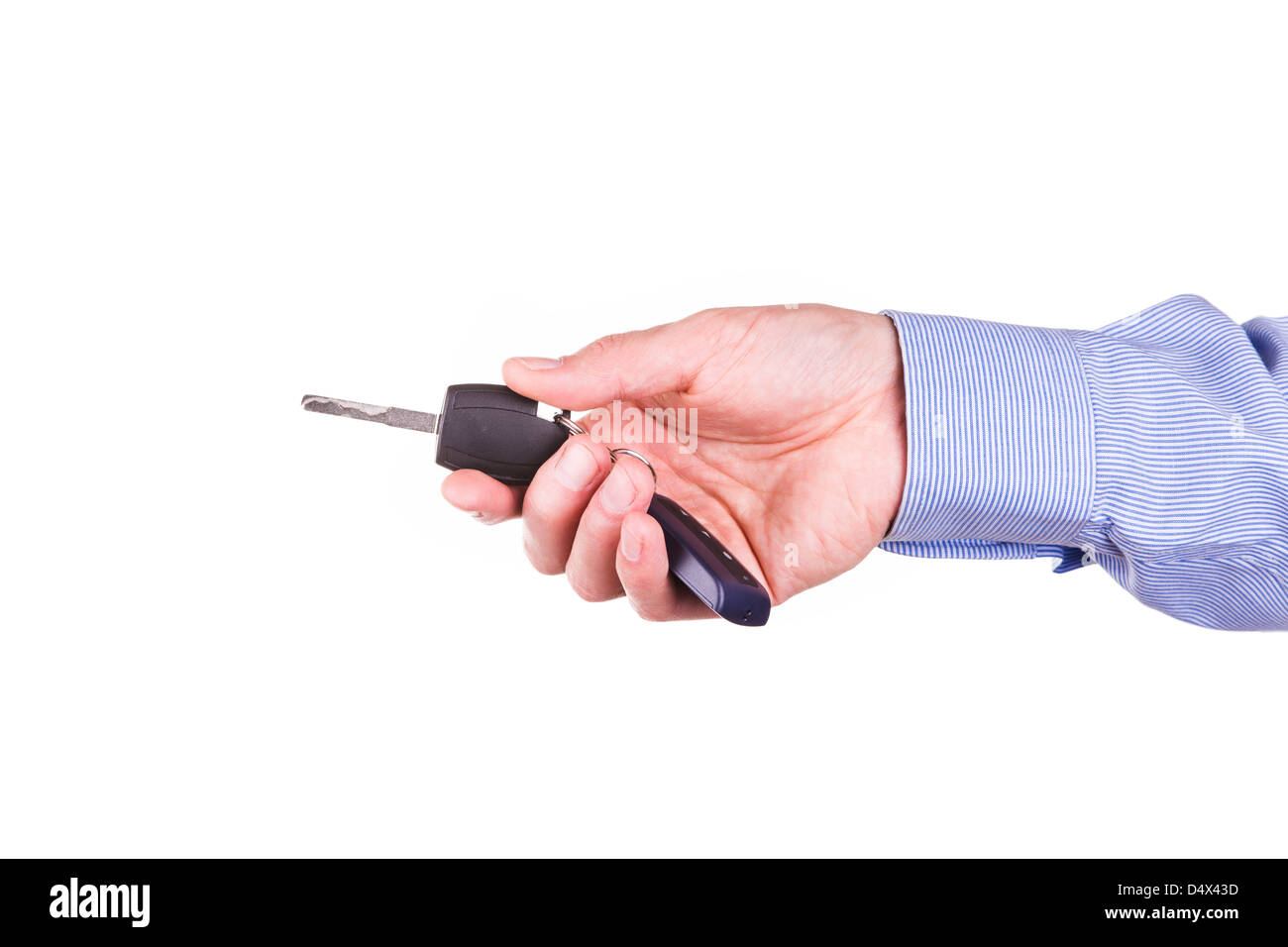 Male hand holding a car key isolated on white background. New car ...