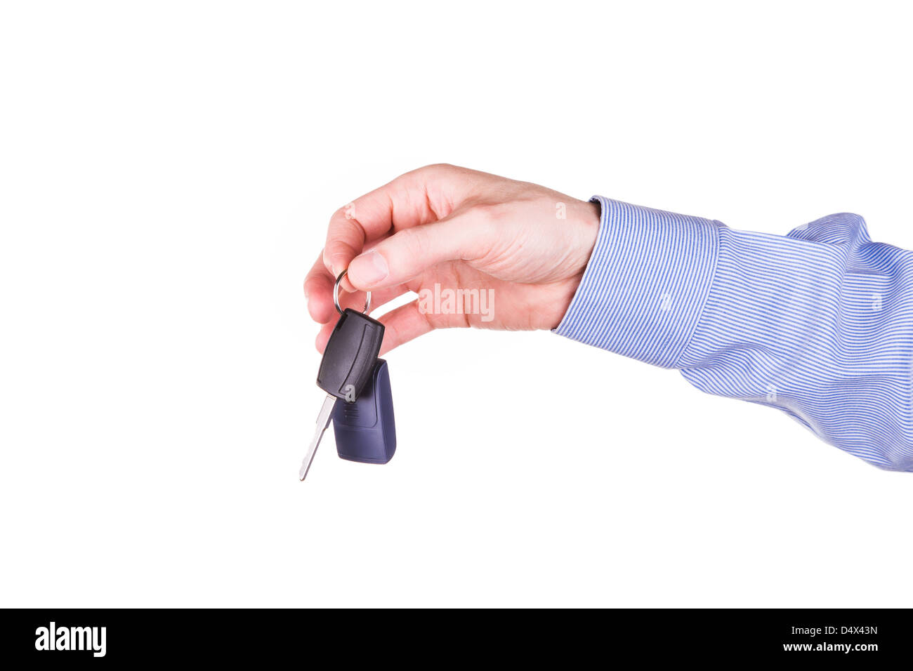 Male hand holding a car key isolated on white background. New car ...